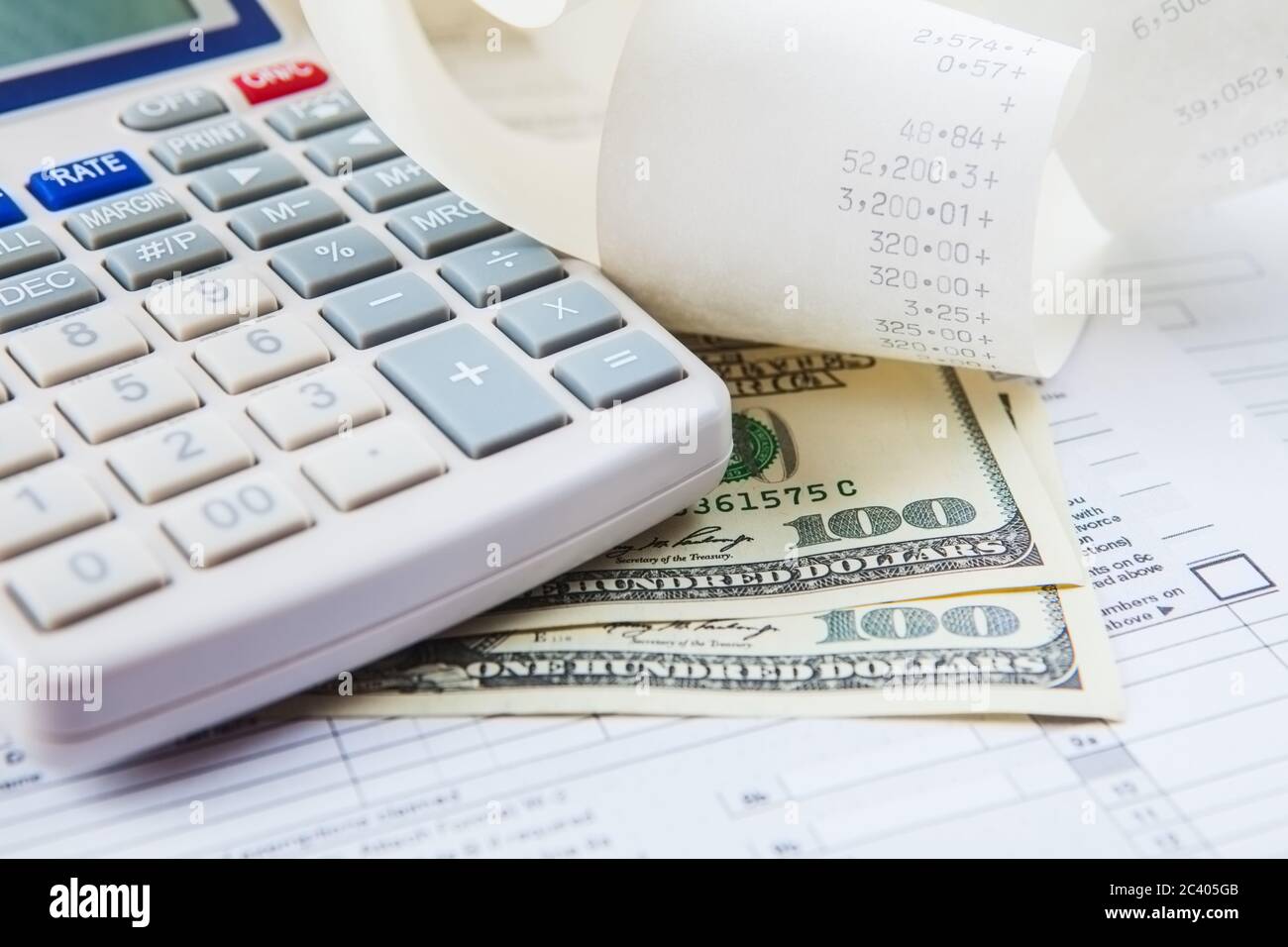 Tax form, calculator and dollar bills Stock Photo - Alamy