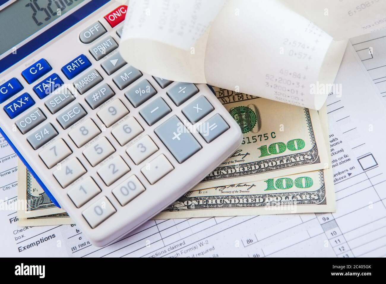 Tax form, calculator and dollar bills Stock Photo - Alamy