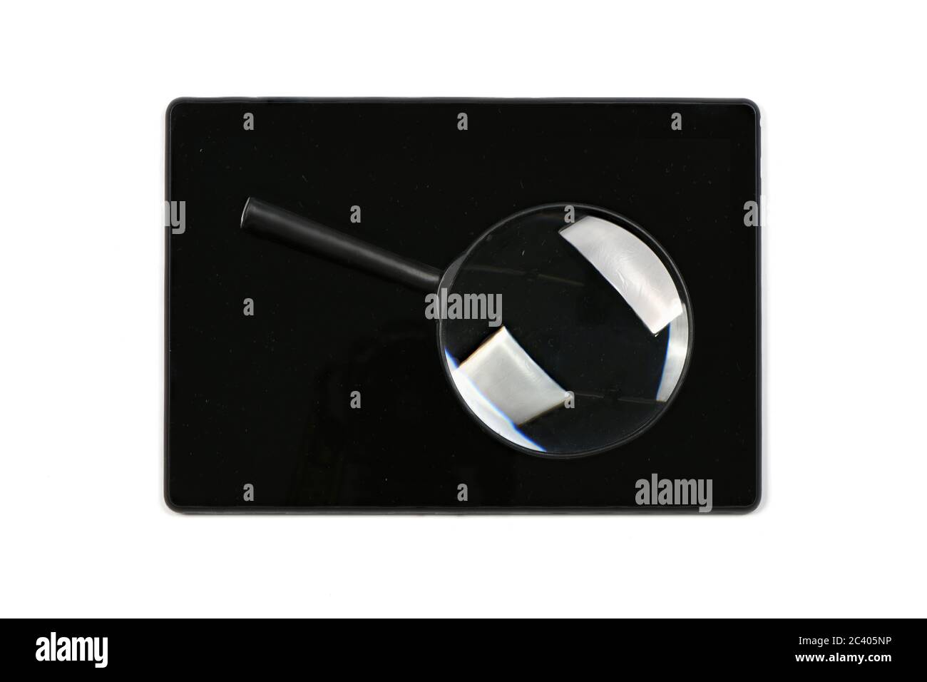 magnifying glass on tablet pc isolated on white background. High ...