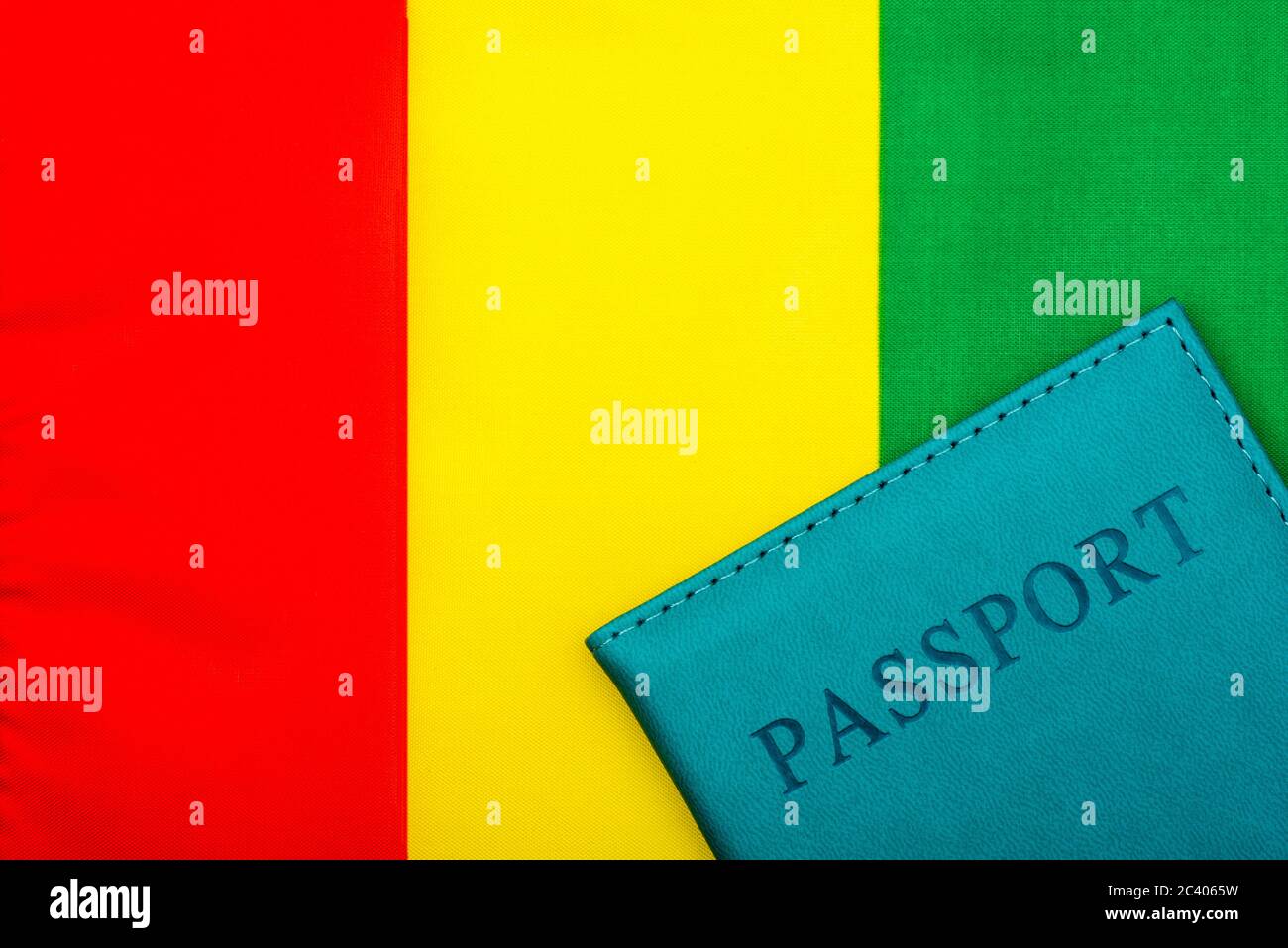 On the background of the flag of Guinea is a passport. The concept of ...