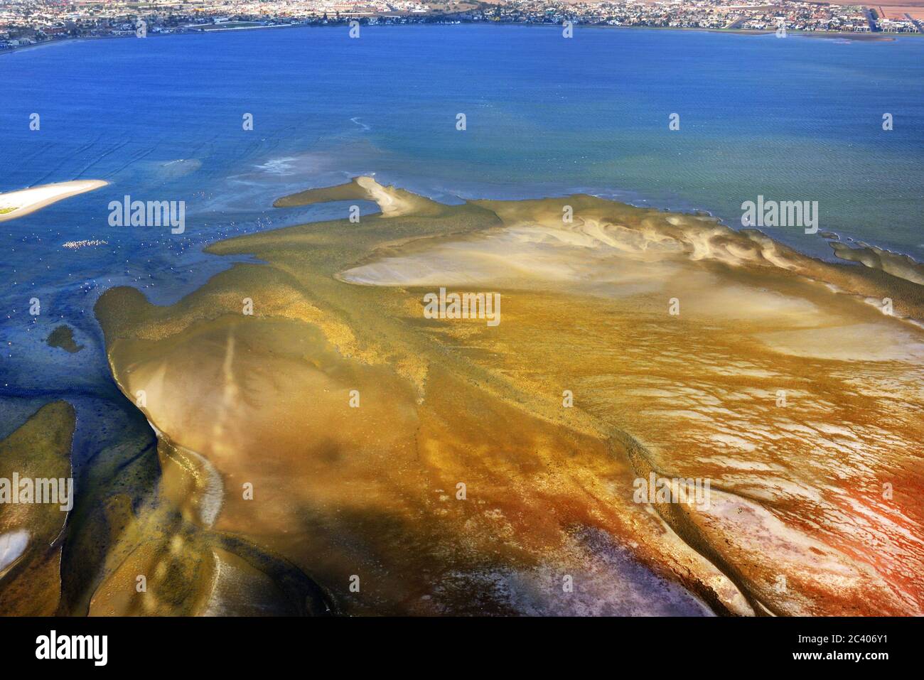Aerial view on the sandbank in the Atlantic ocean near a coast in Namibia and the city Walvis ...