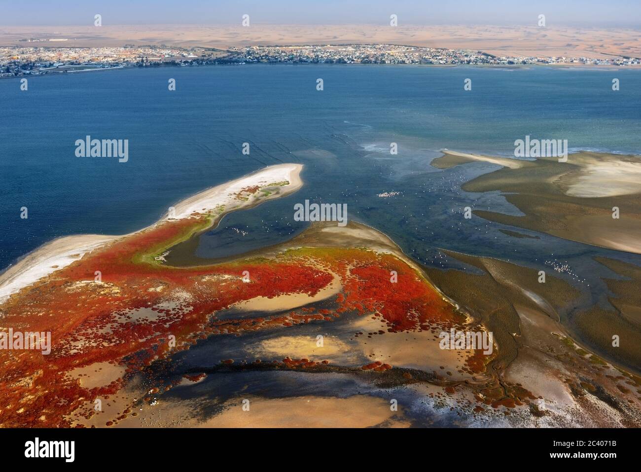 Aerial view on the sandbank in the Atlantic ocean near a coast in Namibia and the city Walvis ...