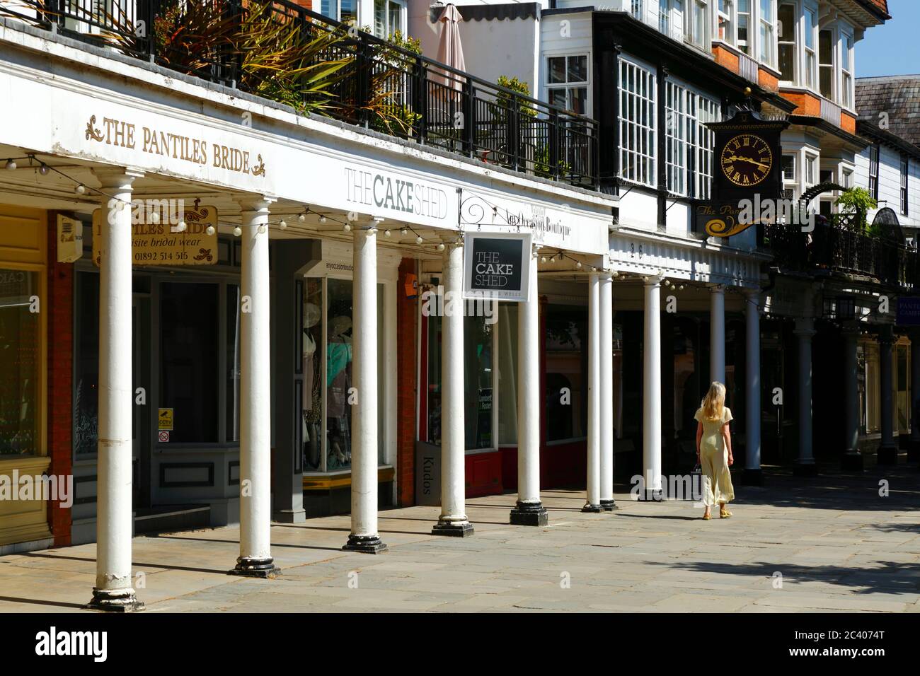 Woman walking past The Pantiles Bride shop, The Pantiles, Royal ...