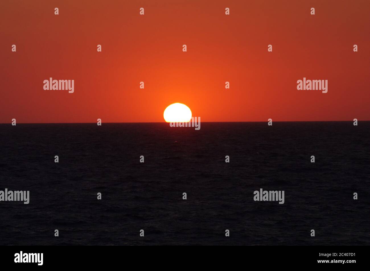 Sequence of images of a sunset from the same viewpoint Sunset into sea ...