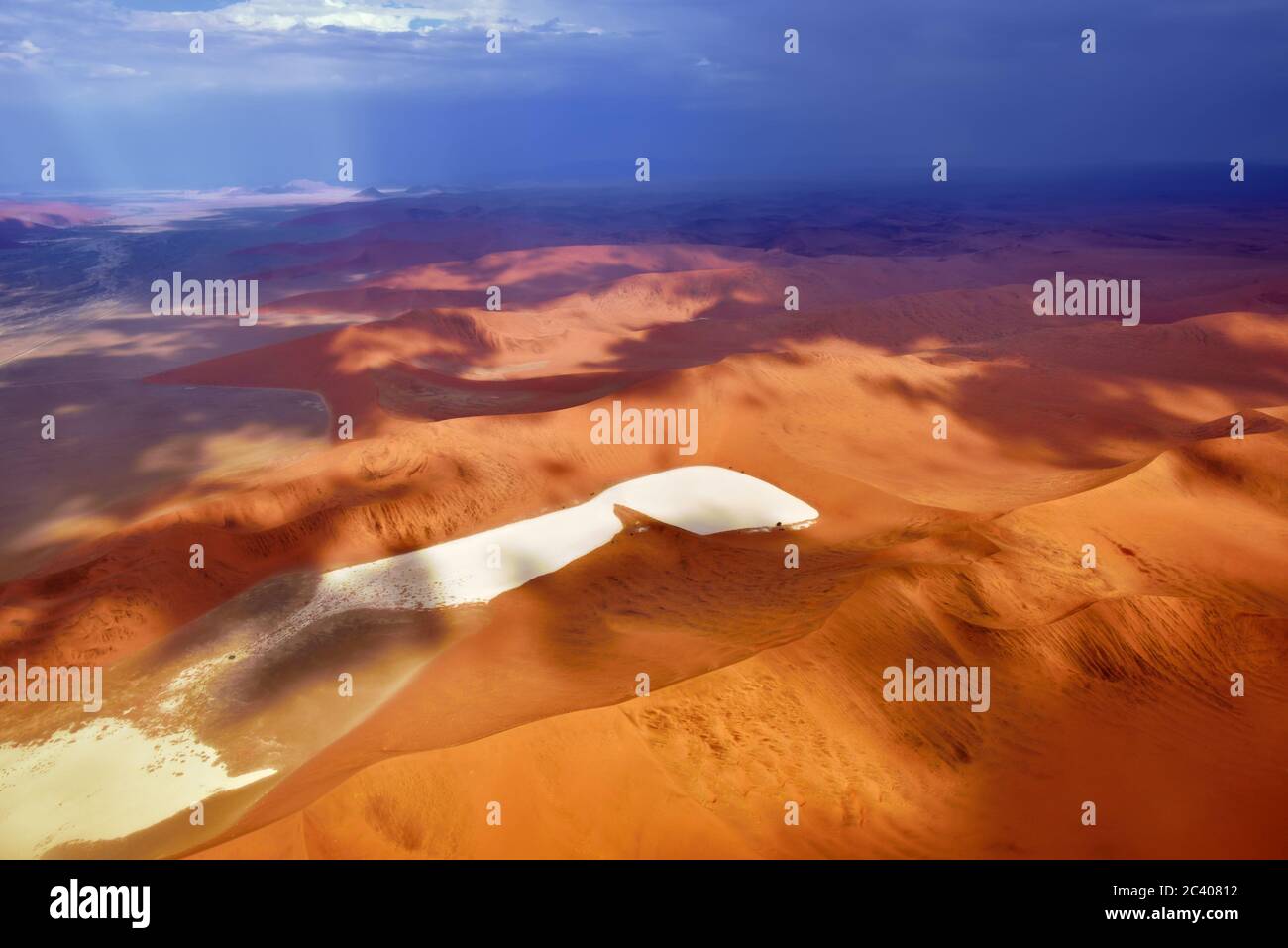 Aerial view of high red dunes and rain on background, located in the ...