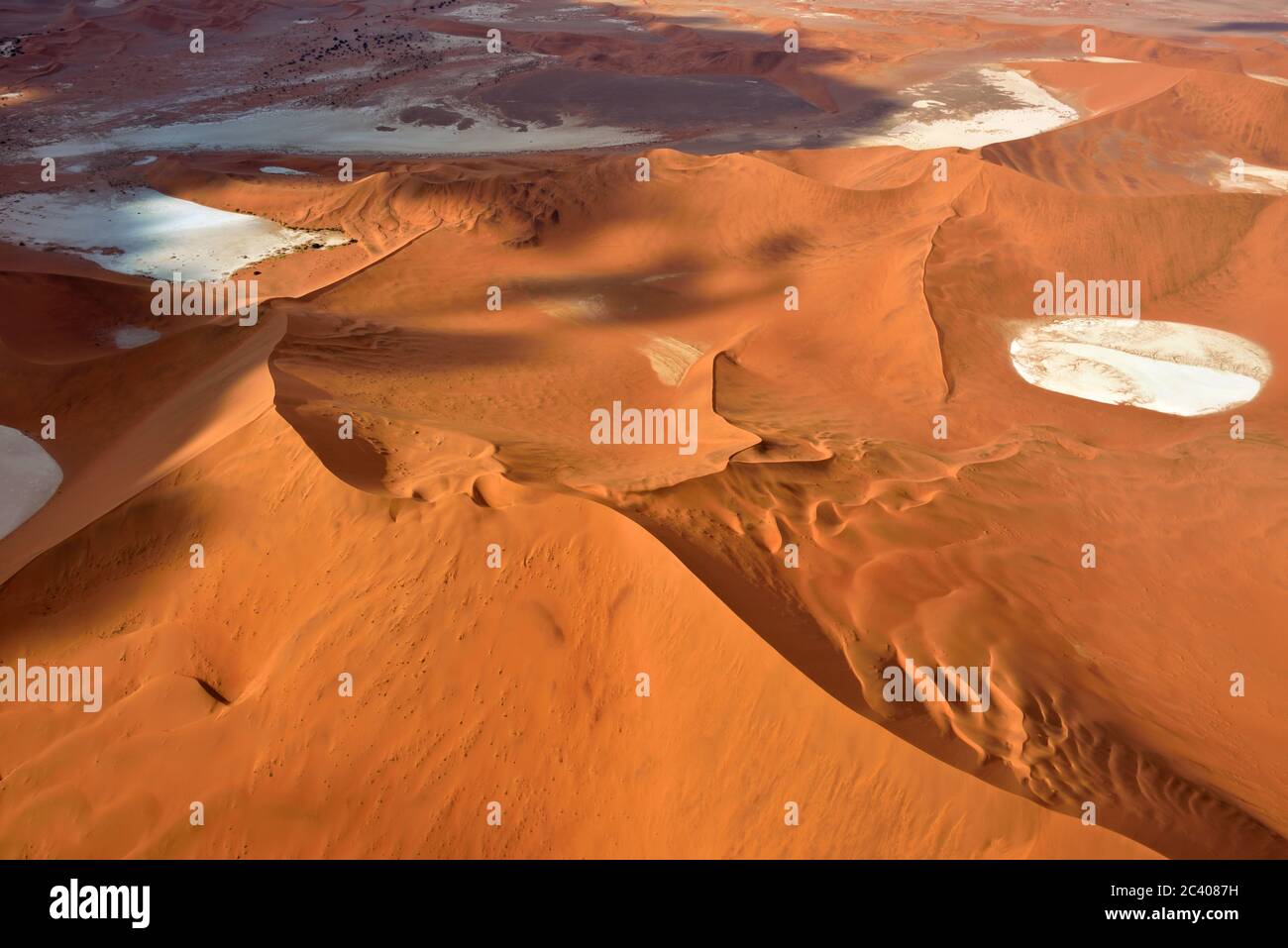 Aerial view of high red dunes, located in the Namib Desert, in the Namib-Naukluft National Park ...