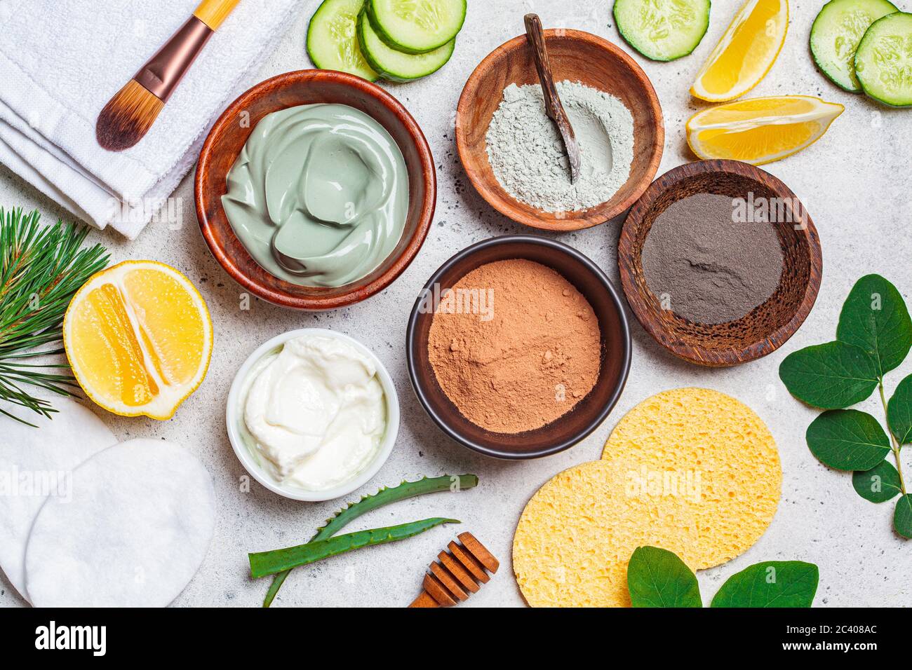 Different types of dry clay in a wooden bowl for the preparation of ...