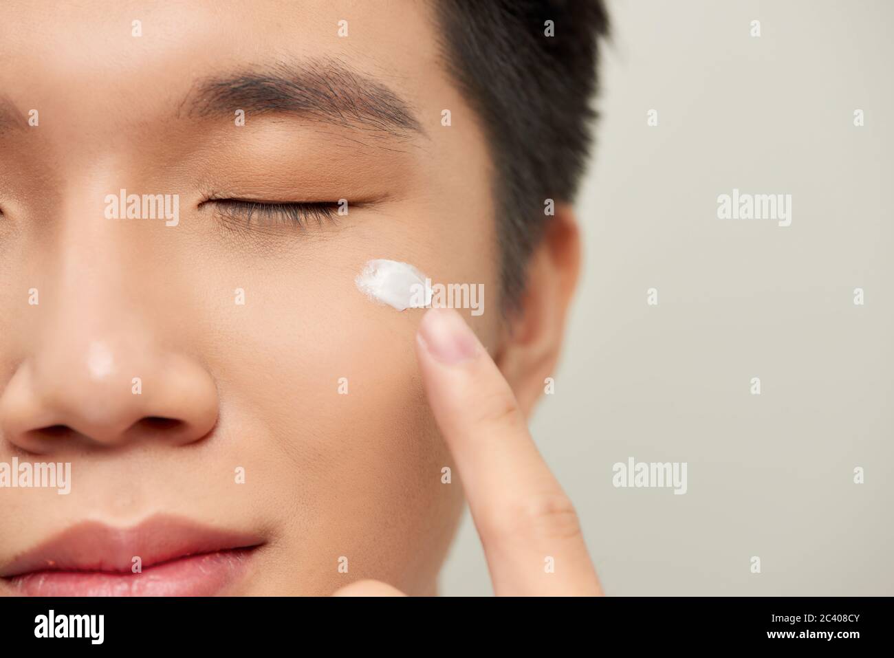 Portrait of a charming handsome young guy has healthy perfect skin ...