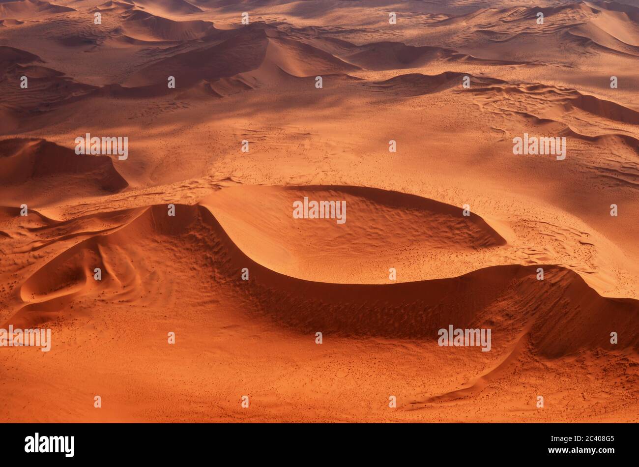Aerial view of high red dunes, located in the Namib Desert in Namibia ...