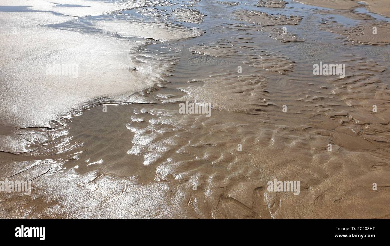 Sand and water Stock Photo - Alamy