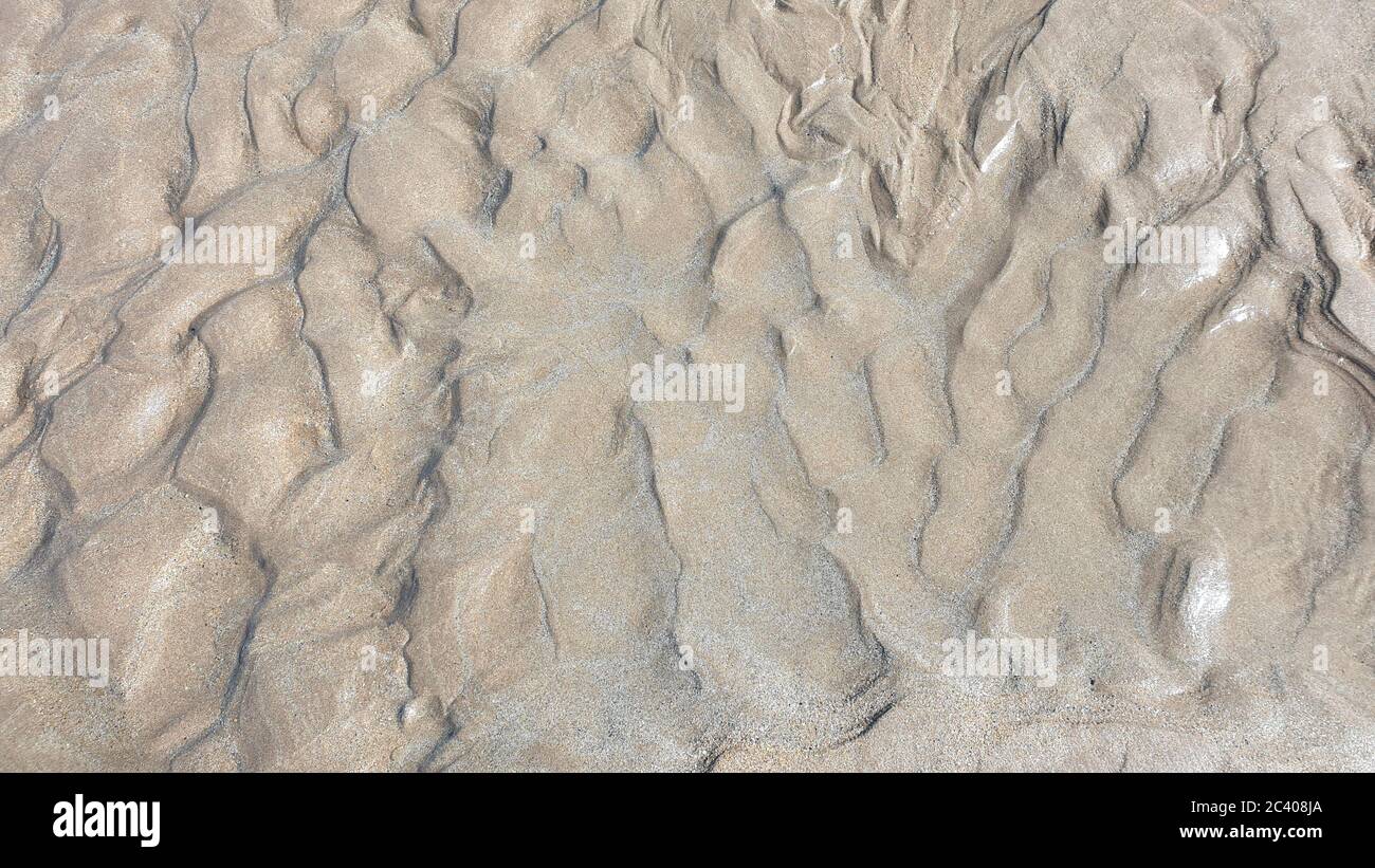 Sand and water Stock Photo - Alamy