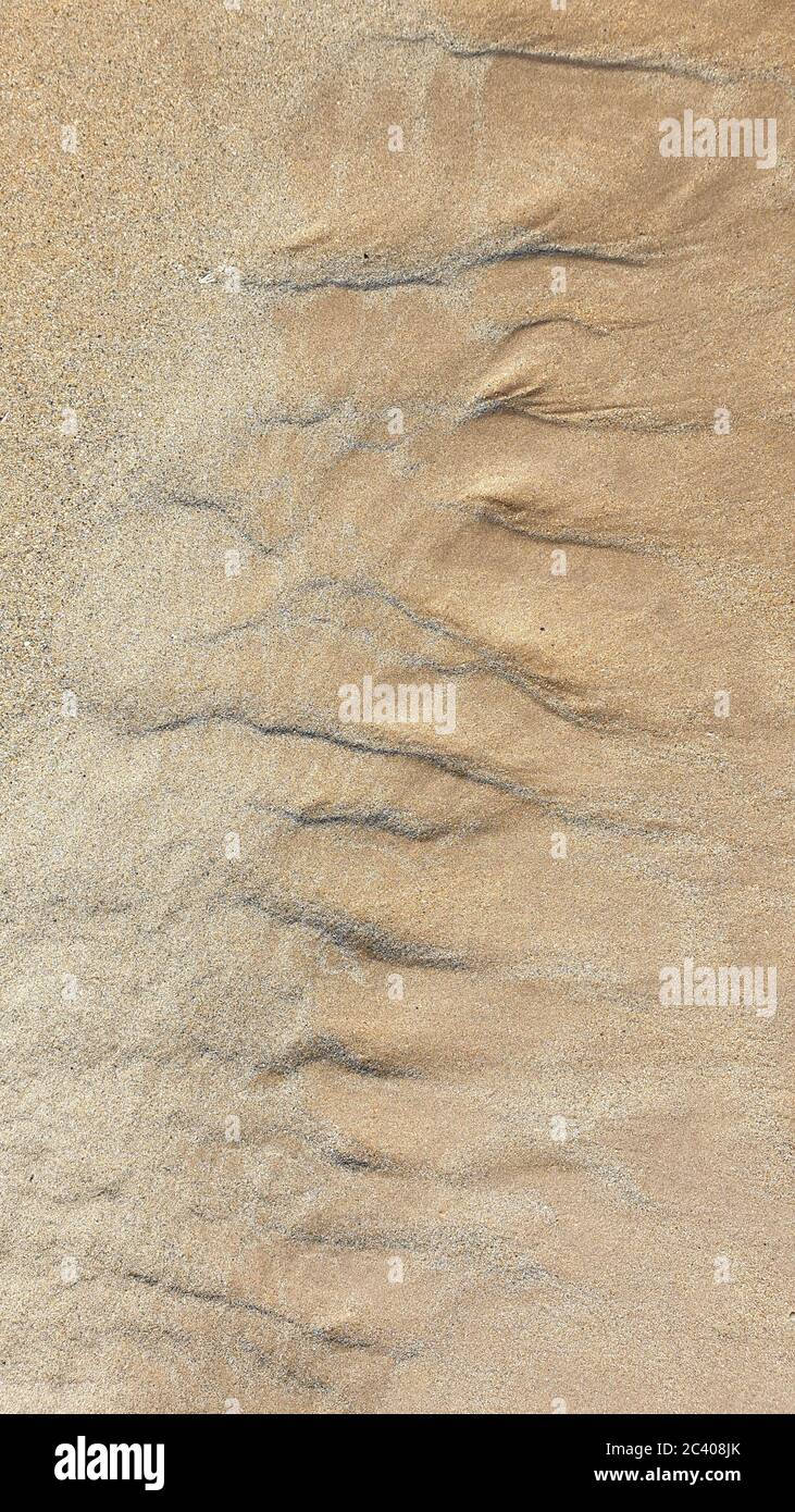 Sand and water Stock Photo - Alamy
