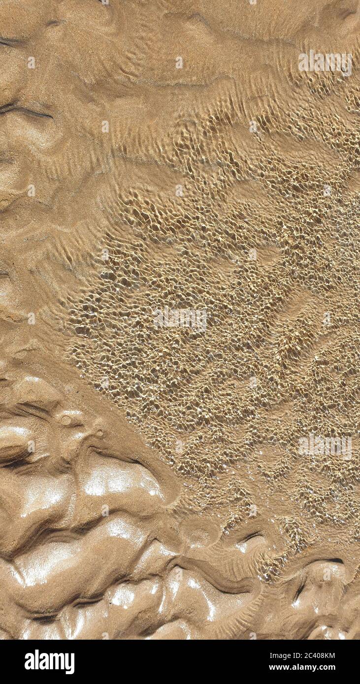 Sand and water Stock Photo - Alamy