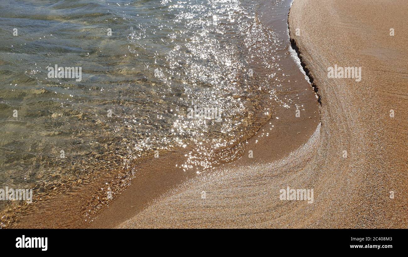Sand and water Stock Photo - Alamy