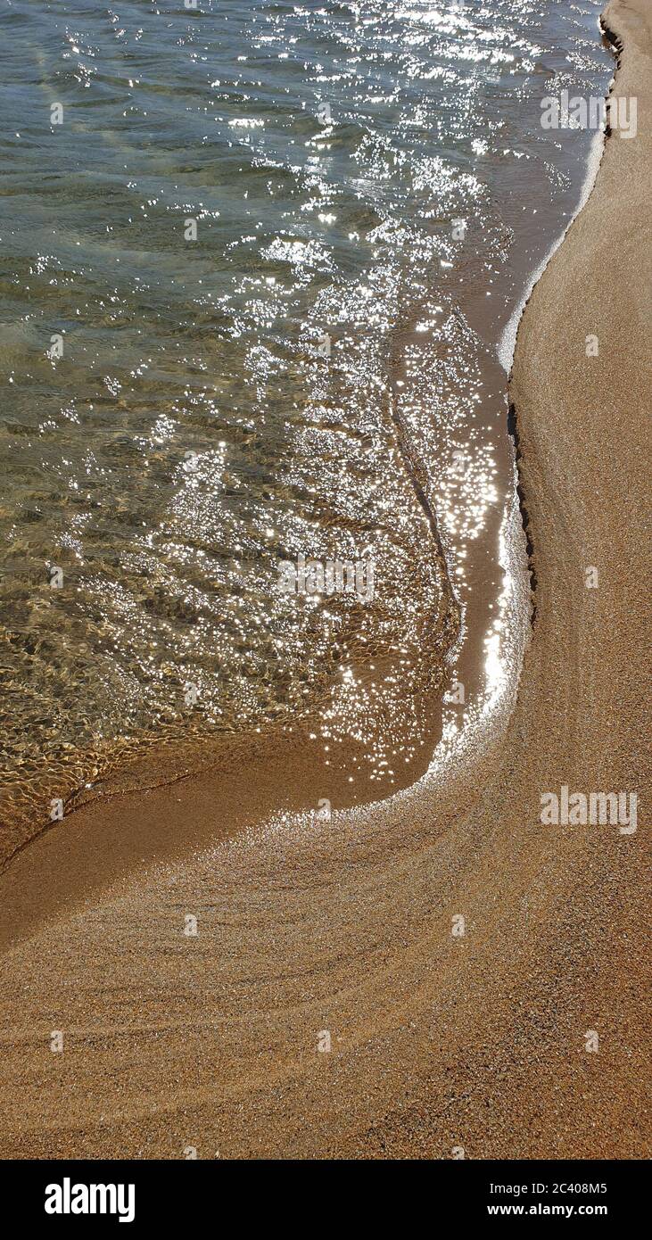 Sand and water Stock Photo - Alamy