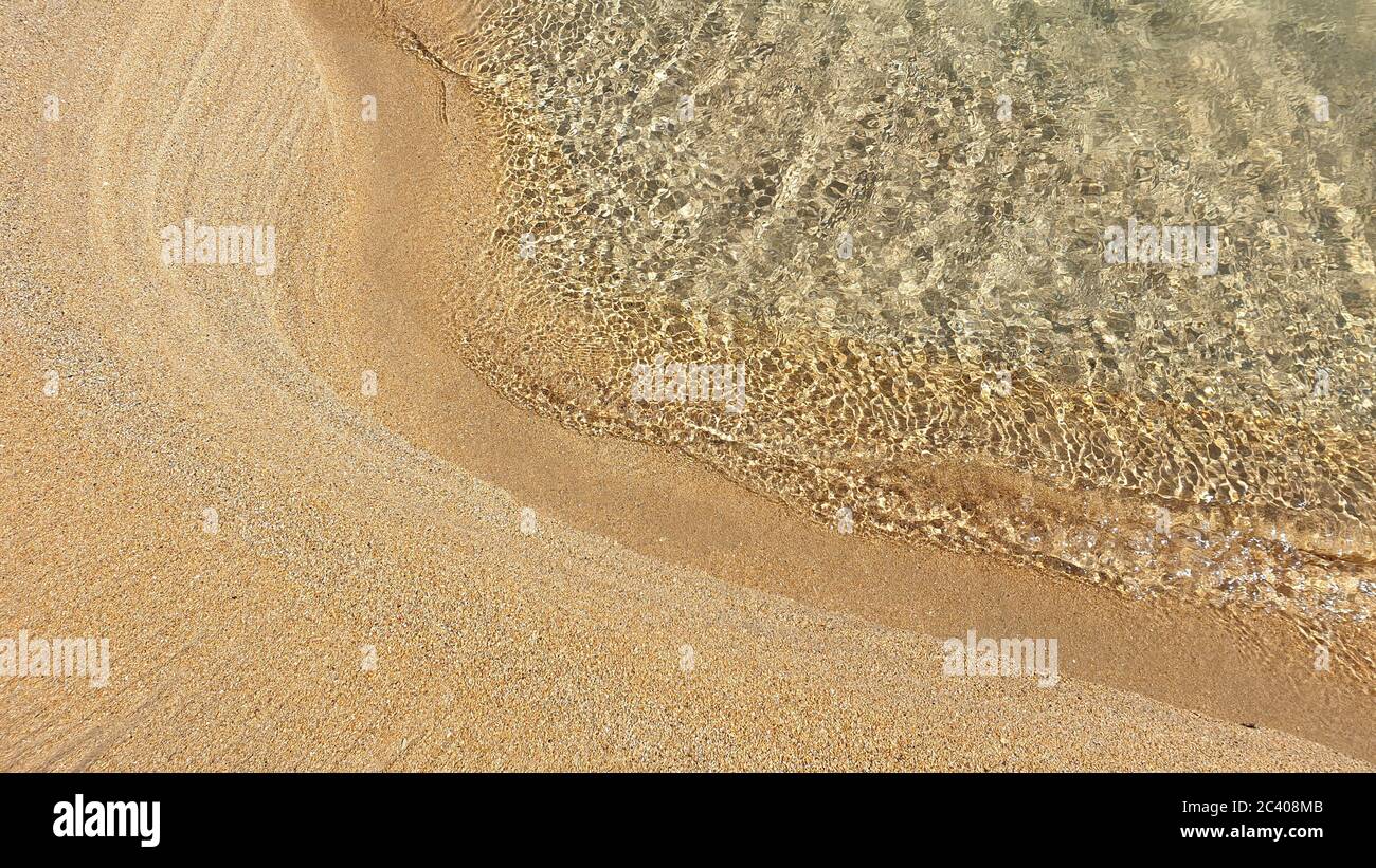 Sand and water Stock Photo - Alamy
