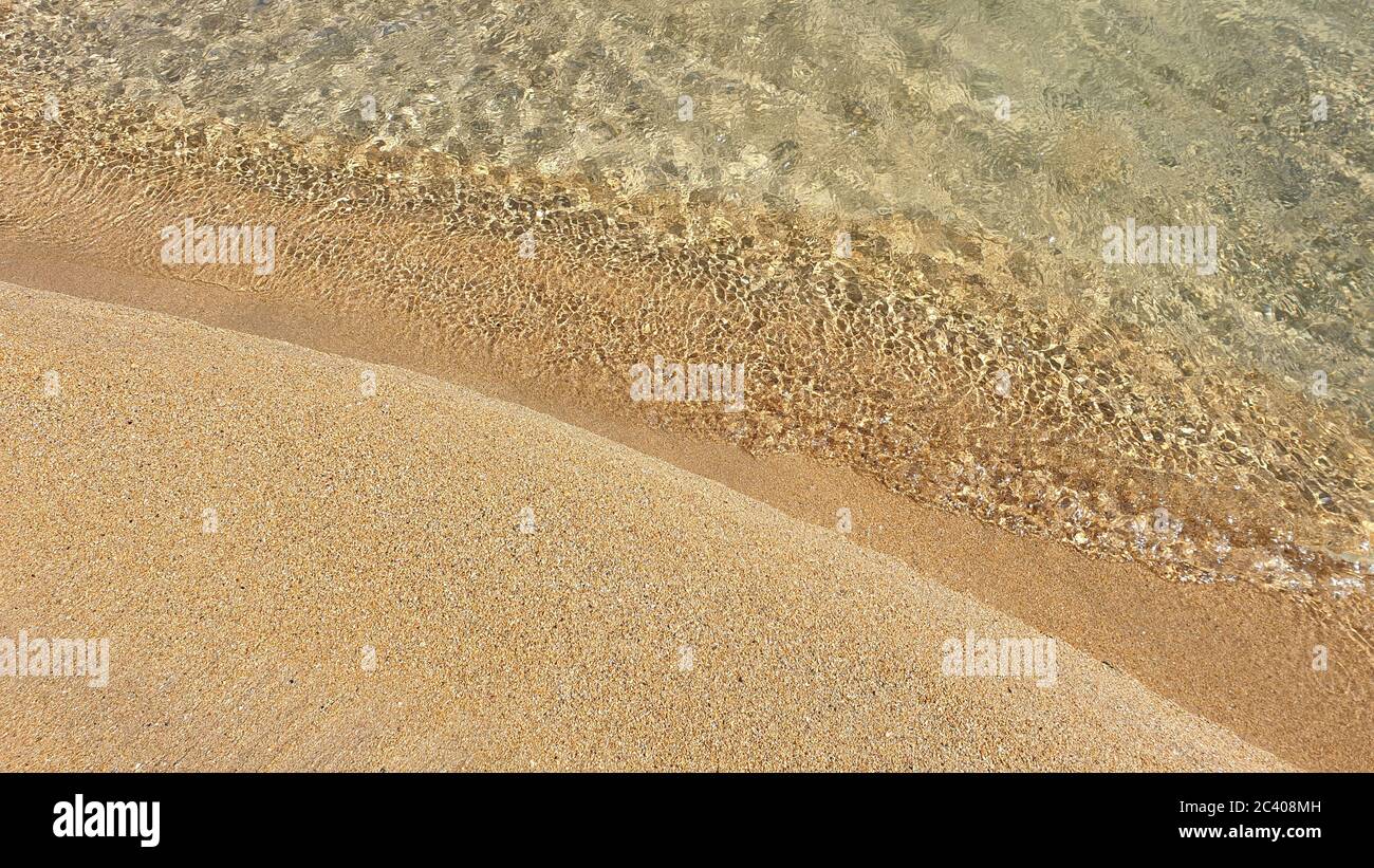 Sand and water Stock Photo - Alamy