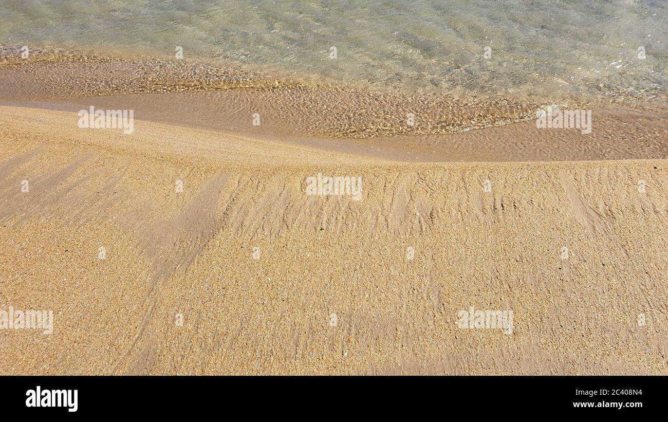 Sand and water Stock Photo - Alamy