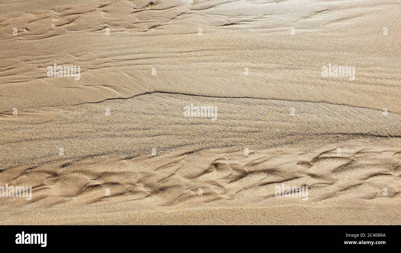 Sand and water Stock Photo - Alamy