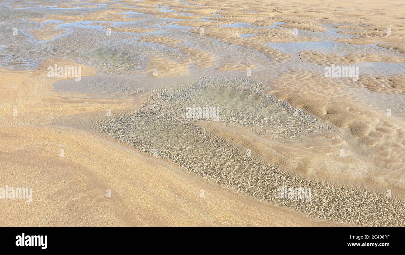 Sand and water Stock Photo - Alamy