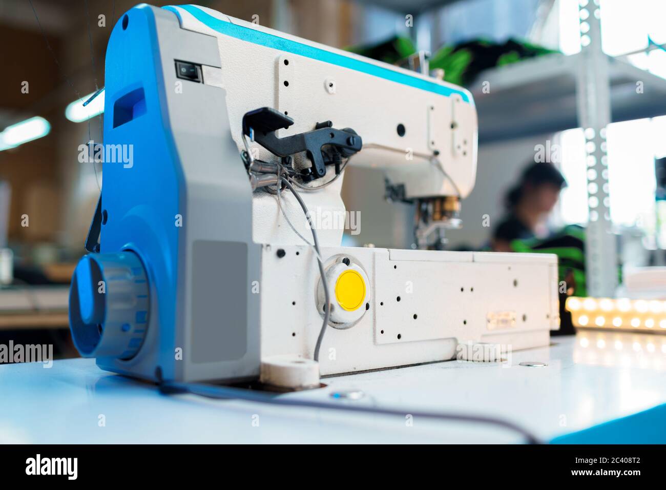 Sewing department of a textile factory interior Stock Photo - Alamy