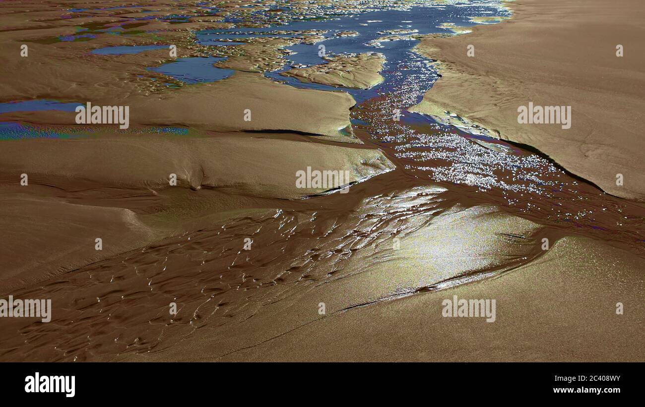 Sand and water Stock Photo - Alamy