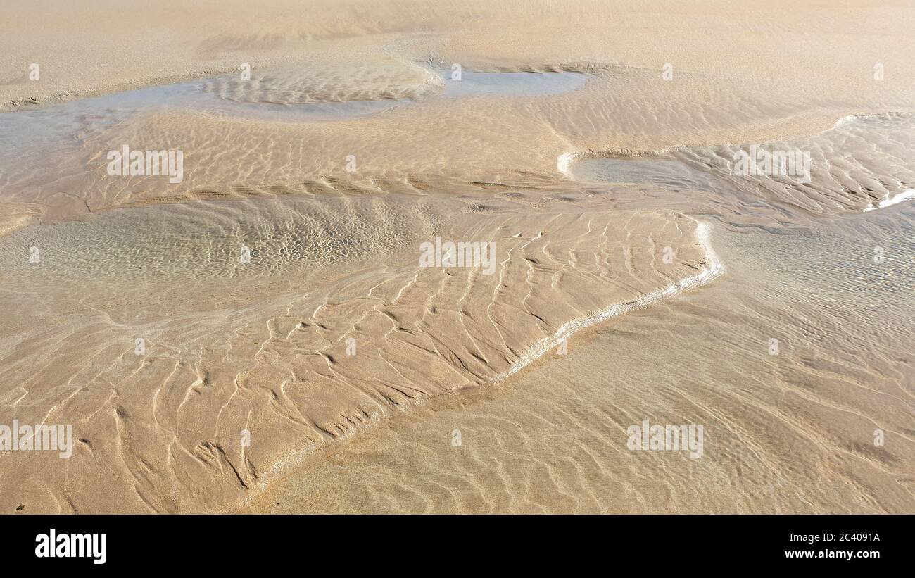 Sand and water Stock Photo - Alamy
