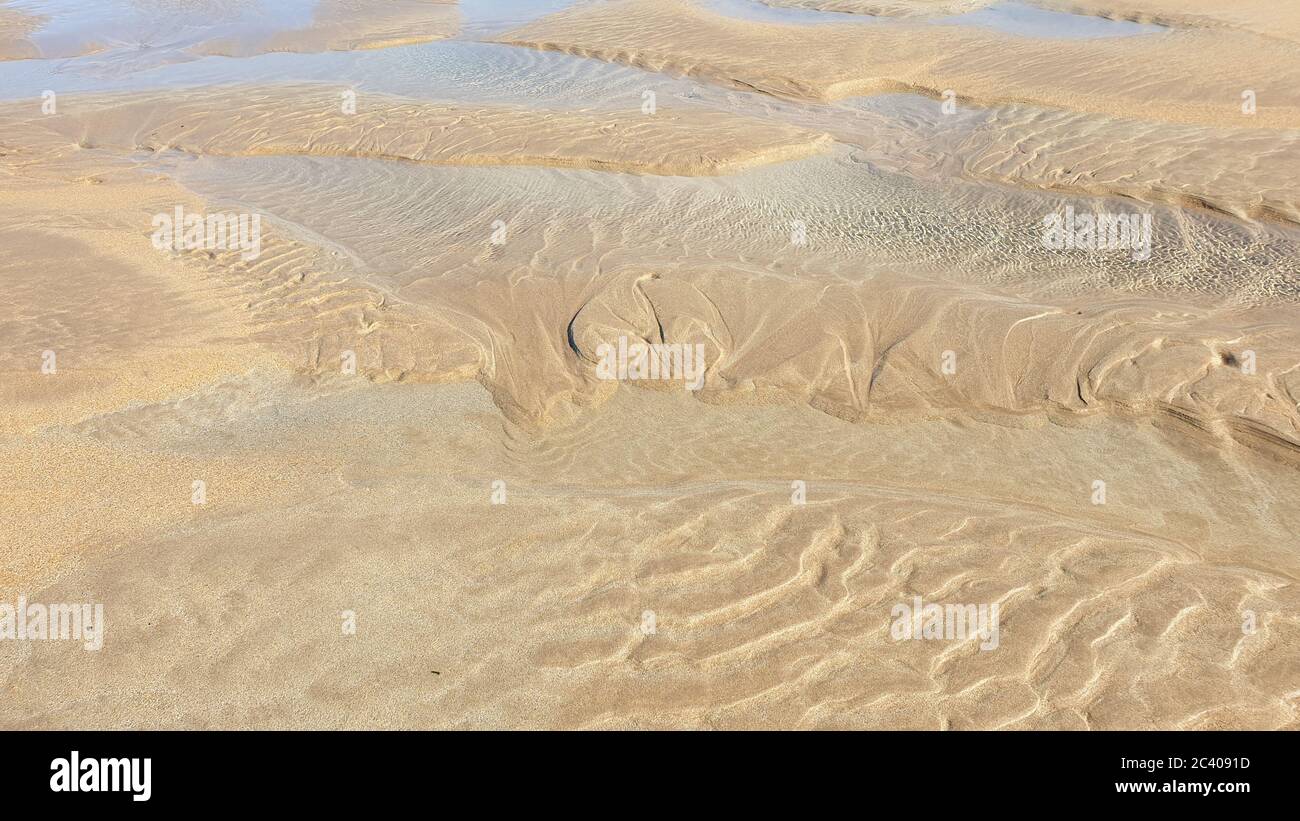 Sand and water Stock Photo - Alamy