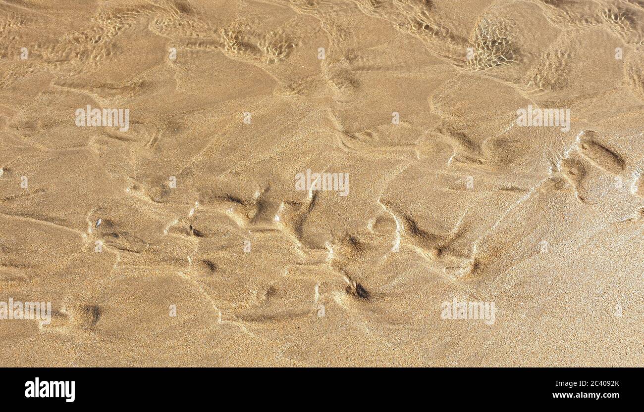 Sand and water Stock Photo - Alamy