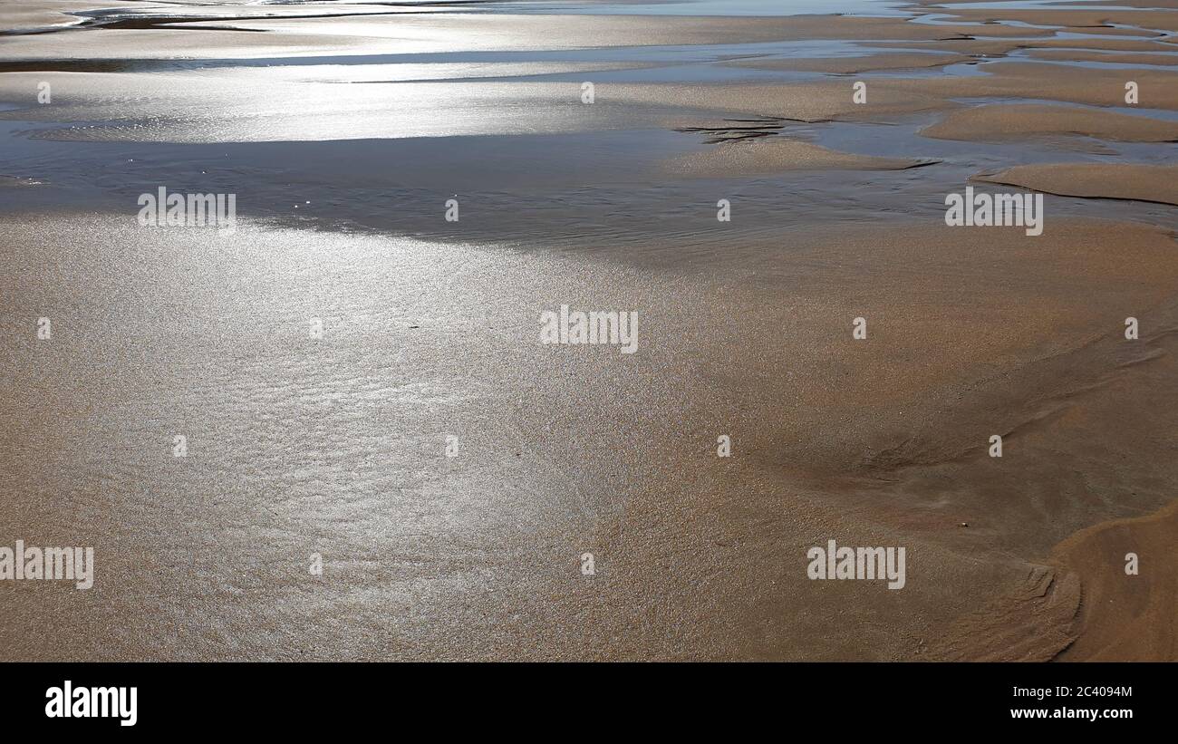 Sand and water Stock Photo - Alamy