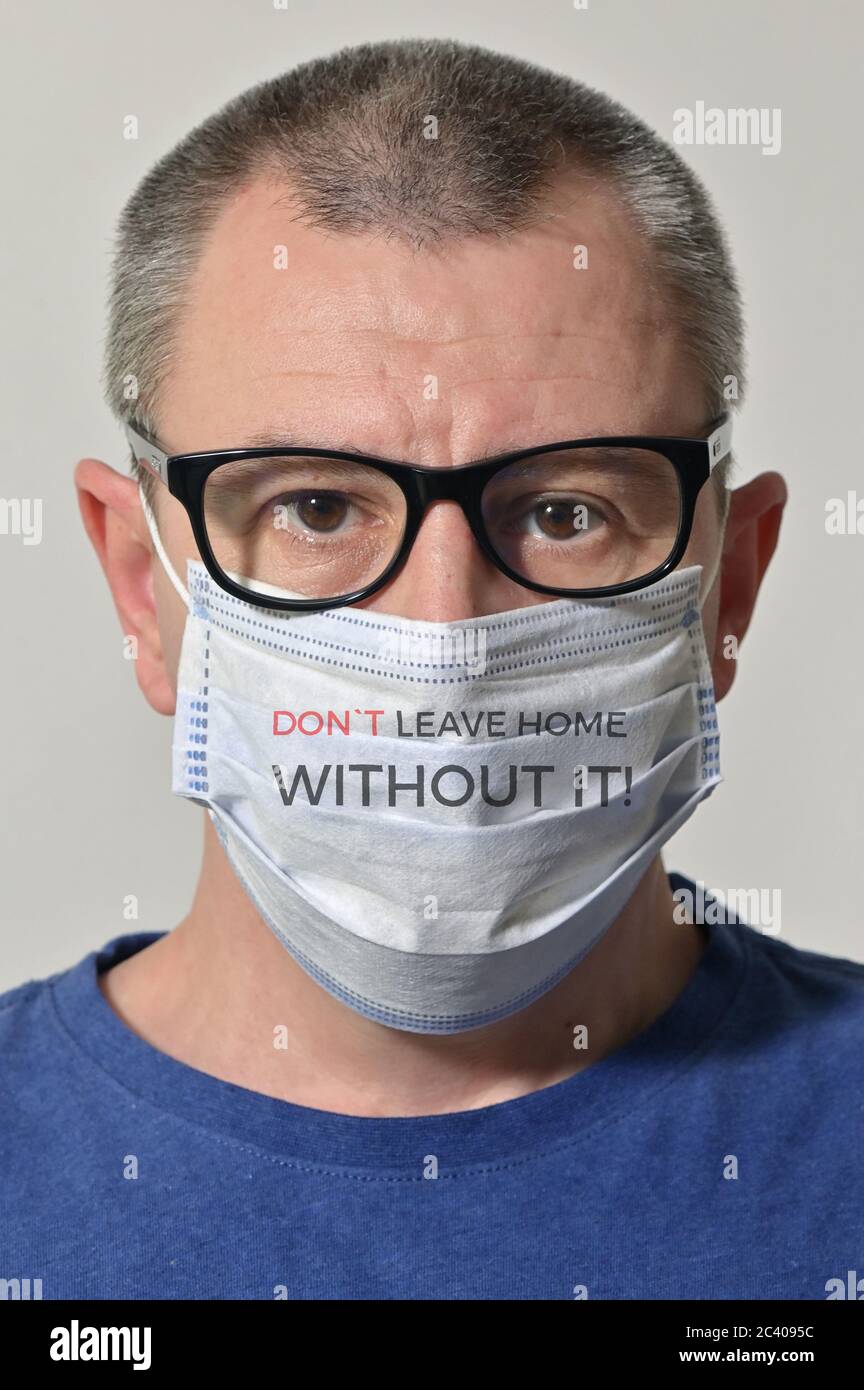 Portrait Of Man Wearing Medical Mask With Tagline Words Stock Photo - Alamy