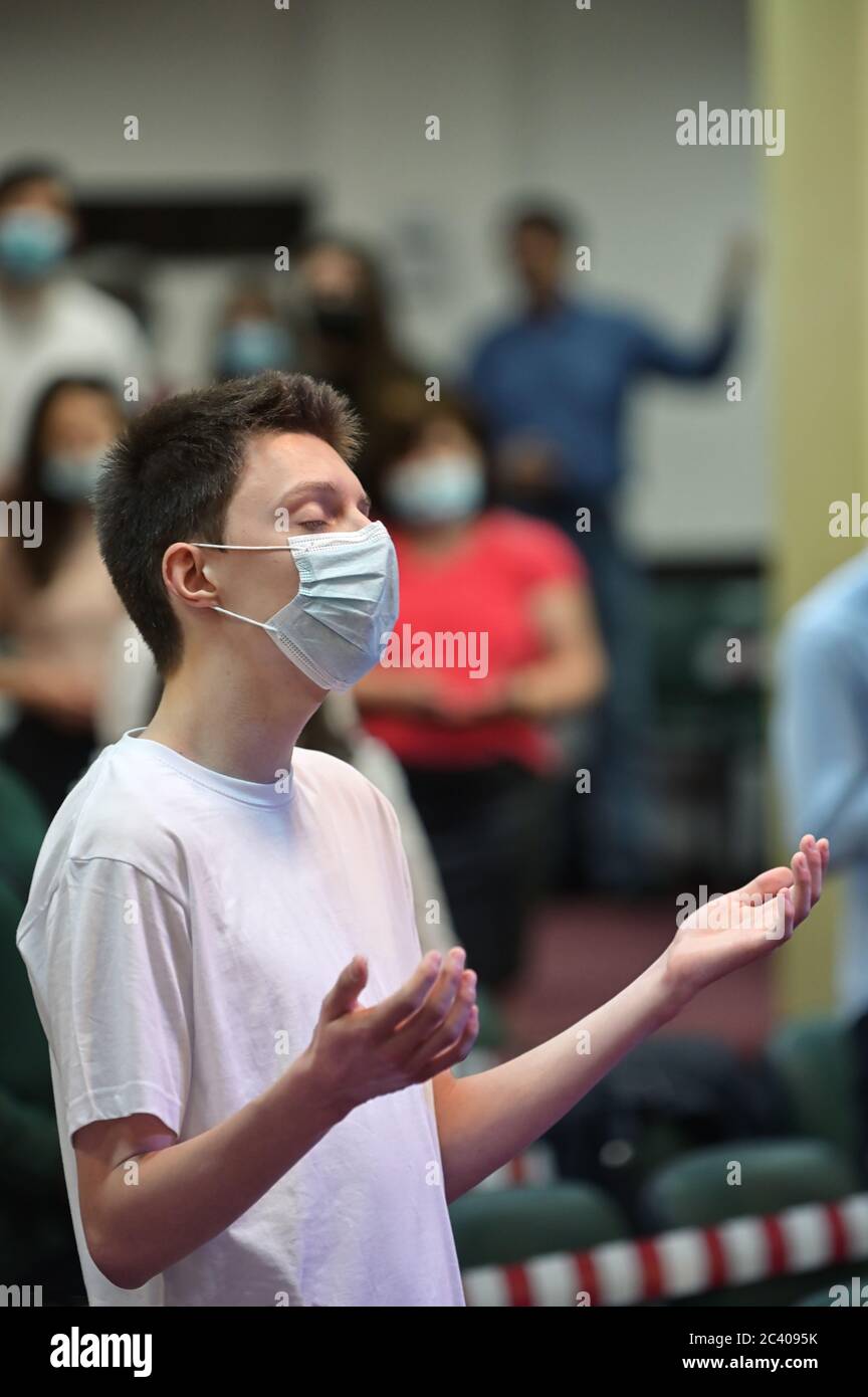 Christian Young man Worship Holding Hands and Social Distancing Stock ...