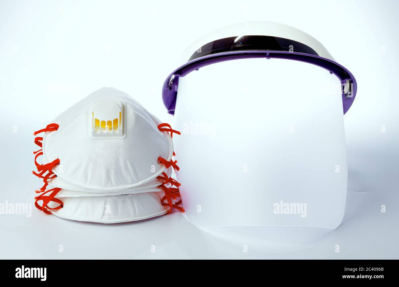 Medical face shield and protective masks on white background Stock ...