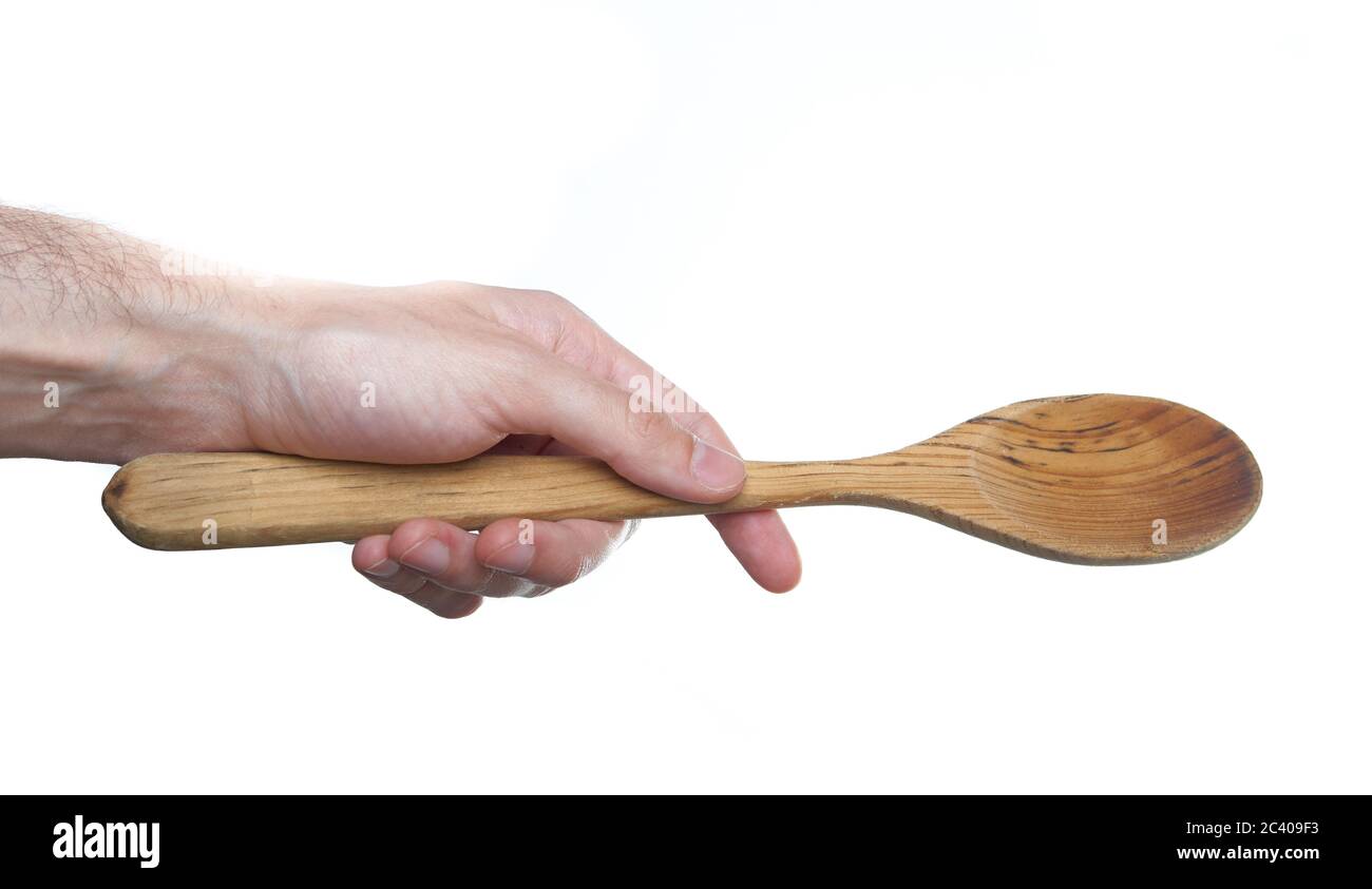 man hand holding kitchen utensil on white background Stock Photo - Alamy