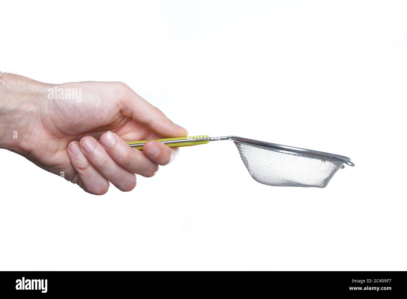 man hand holding strainer utensil. Kitchen concept Stock Photo - Alamy