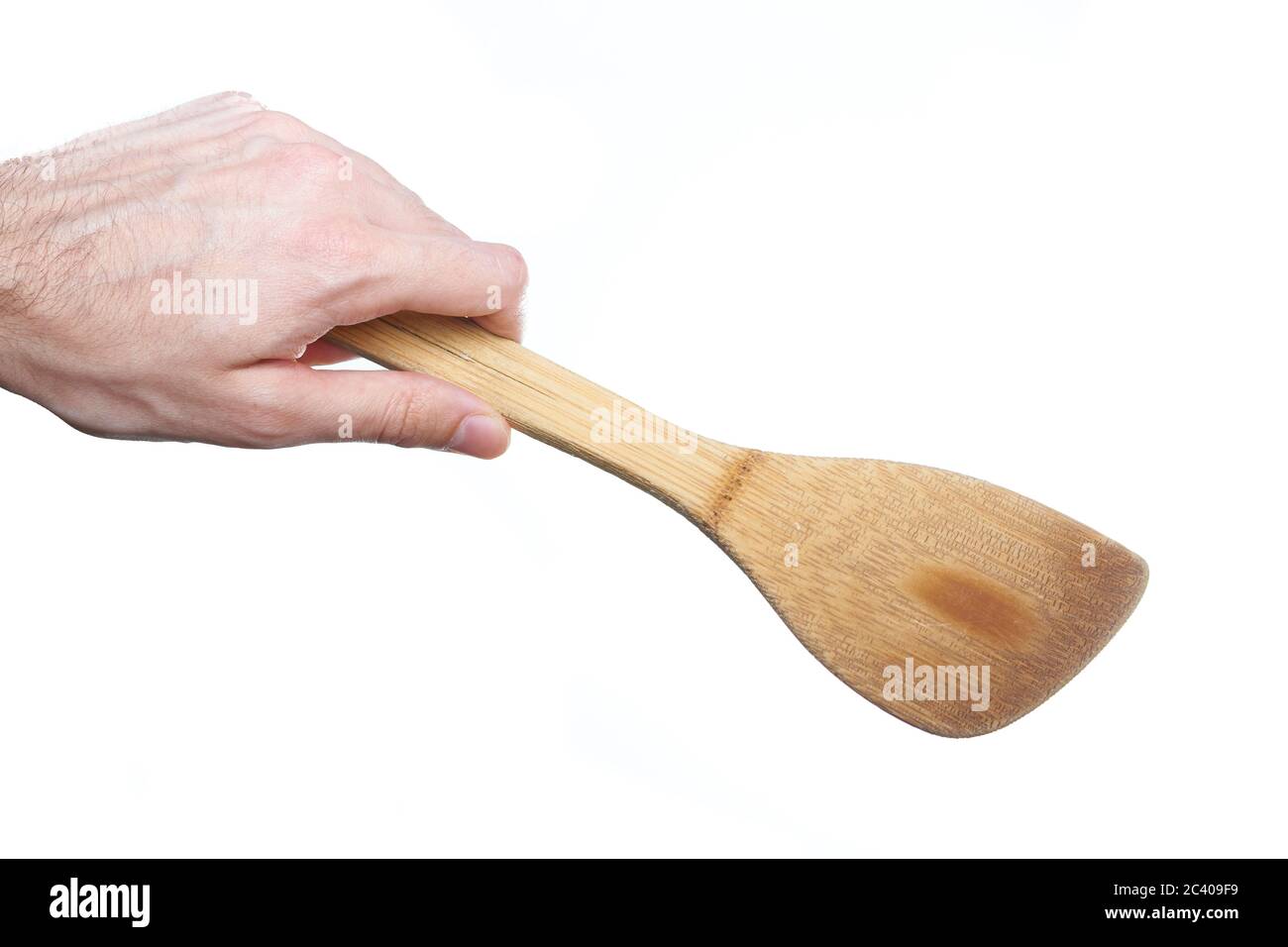 man hand holding kitchen utensil on white background Stock Photo - Alamy