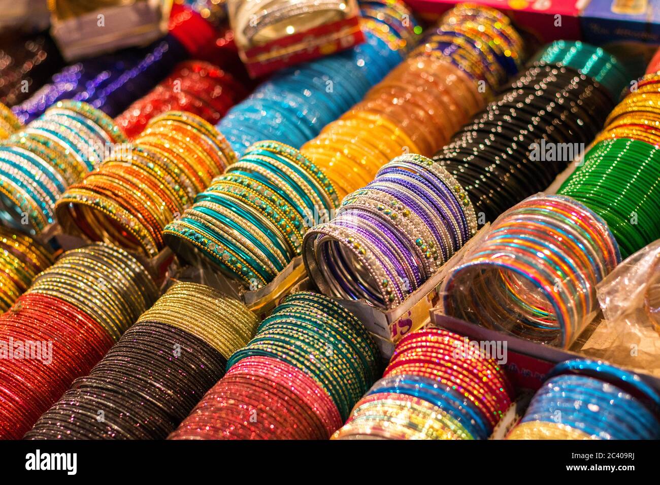 Multi-Colored Indian Glass/Metal Bangles Arranged On The Shelf For Sale ...