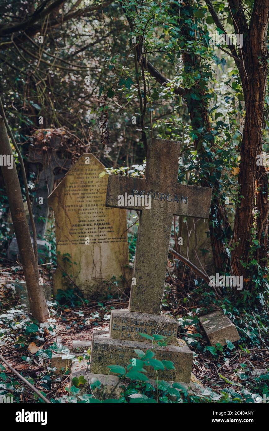 London, UK - June 16, 2020: Cross amongst tombstones inside Hampstead ...