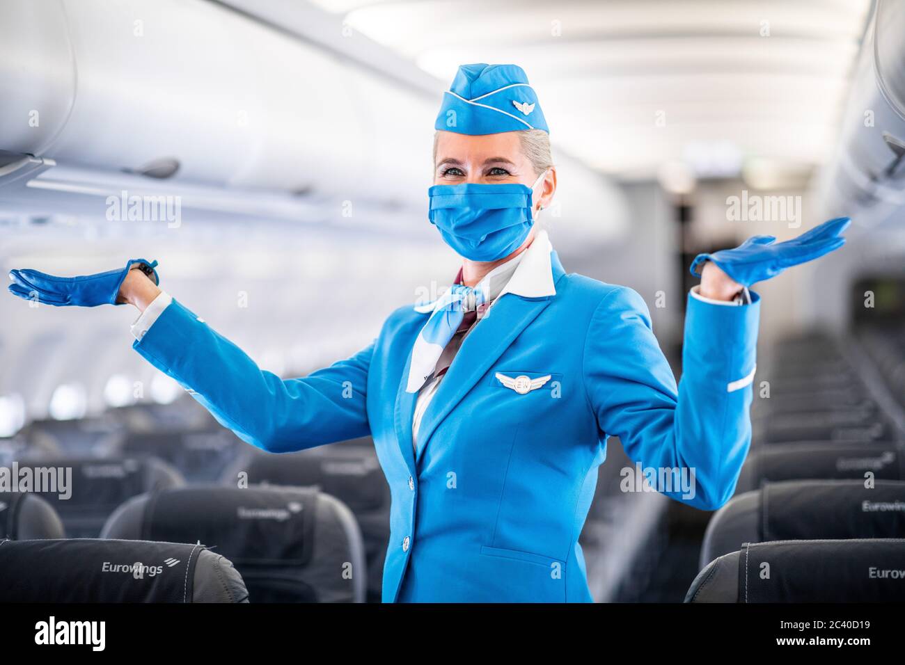 Duesseldorf, Germany. 23rd June, 2020. A flight attendant wearing a ...