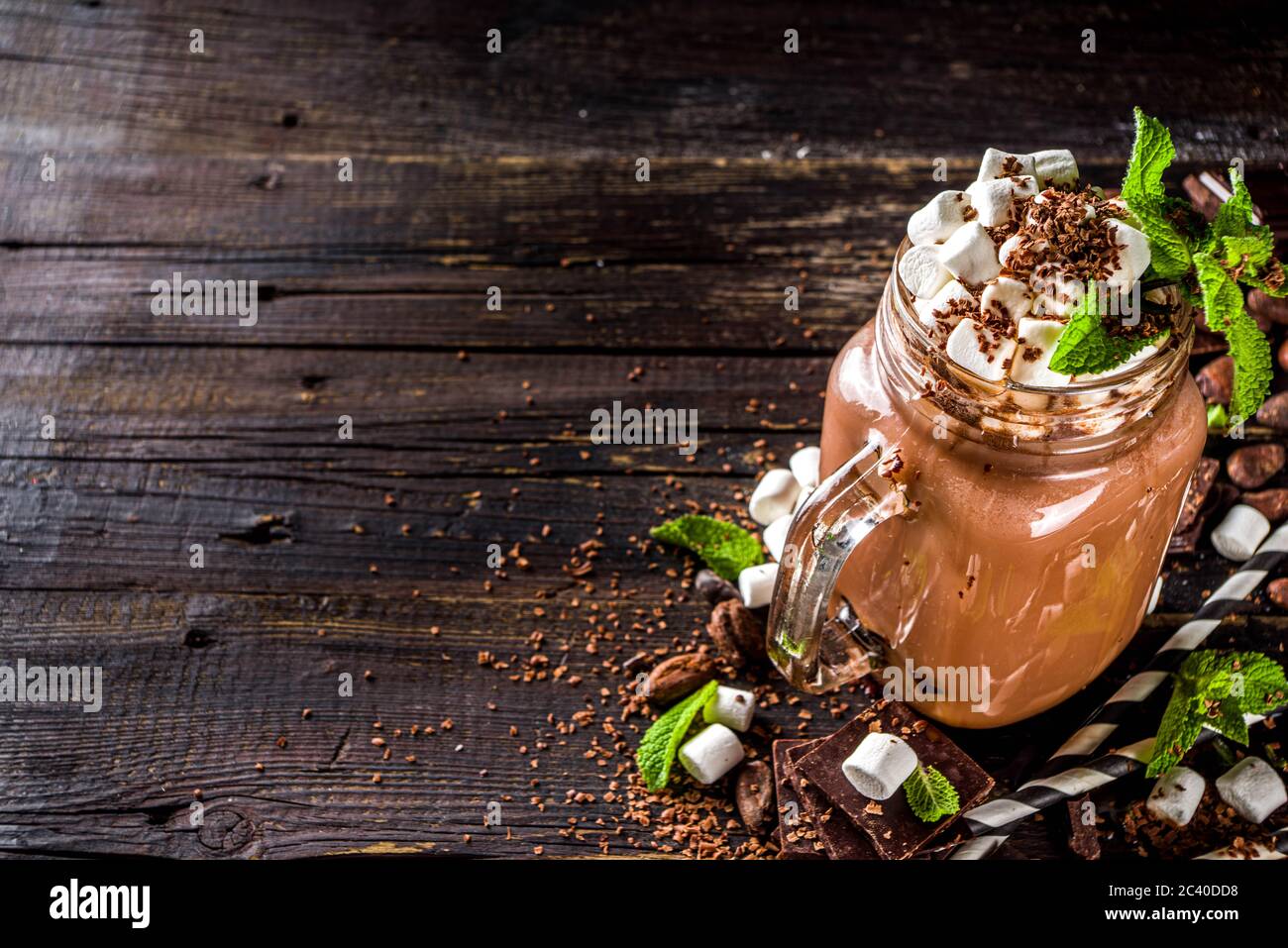 Chocolate milk shake with sauce, marshmallows and grated chocolate ...