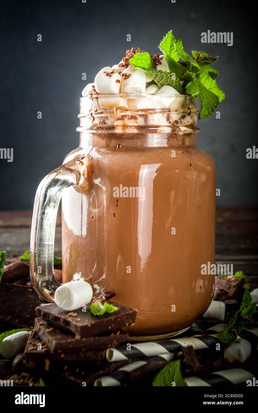 Chocolate milk shake with sauce, marshmallows and grated chocolate ...