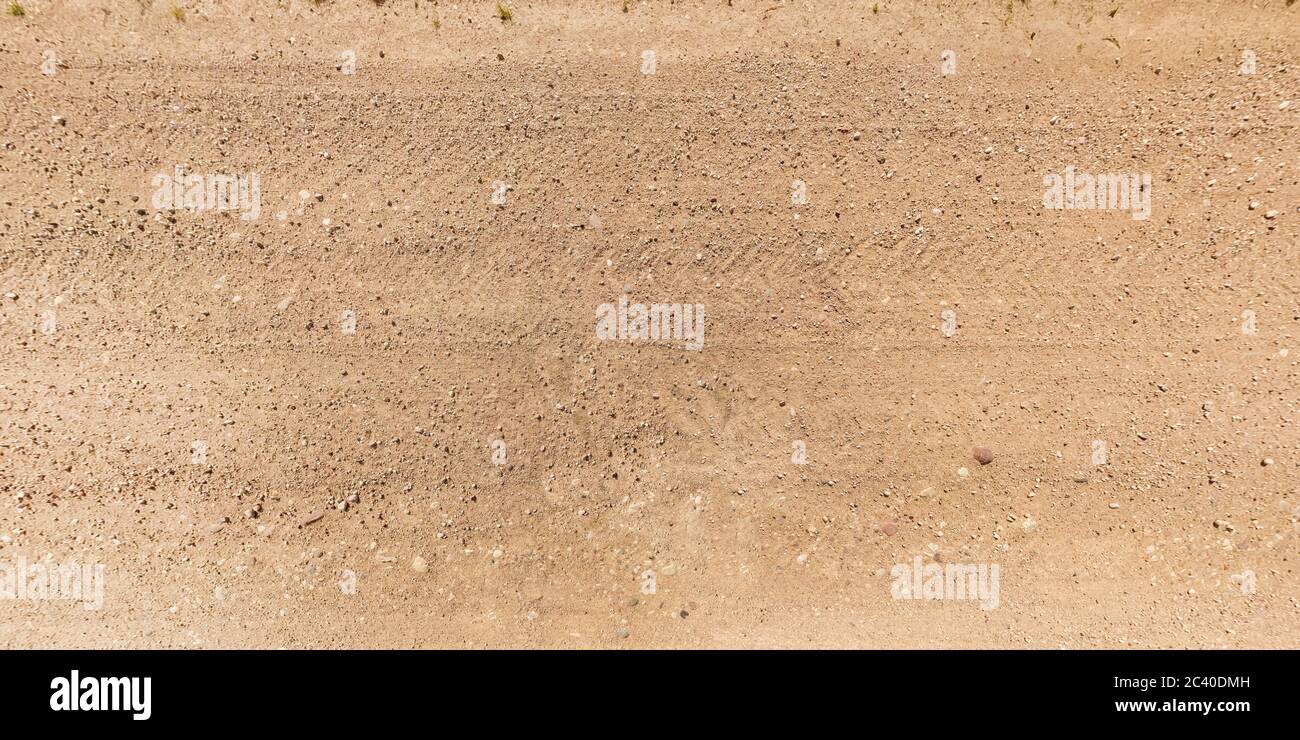 view from above on texture of gravel road with car tire tracks Stock ...