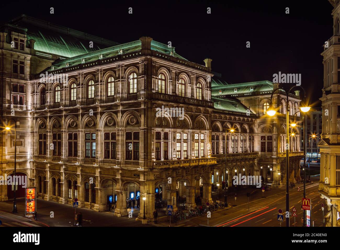 The illuminated building of the Vienna State Opera that is located ...