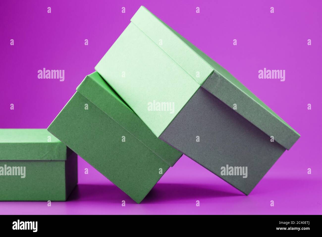 Boxes on a pink background are scattered Stock Photo - Alamy