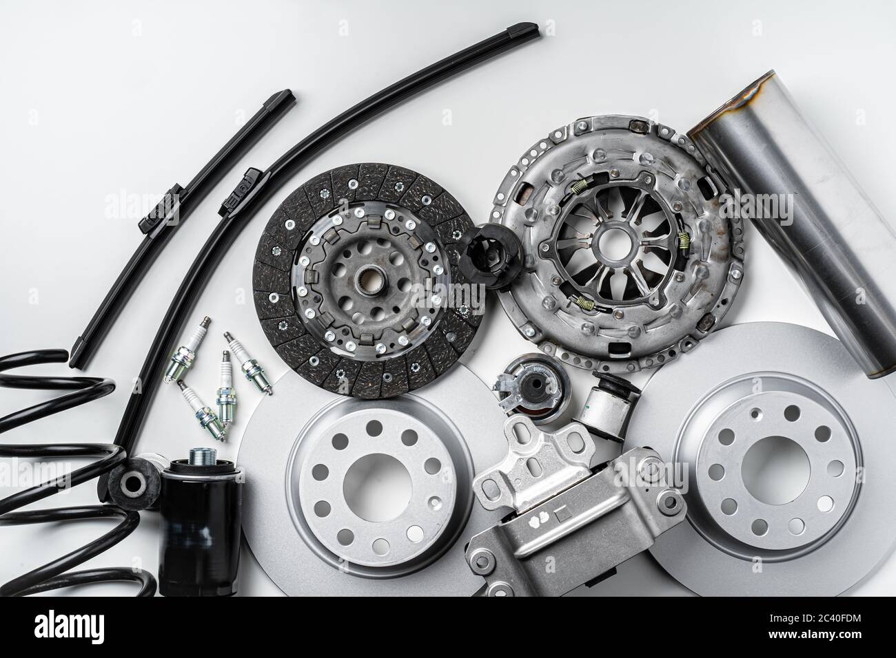 New metal auto parts on grey background Stock Photo - Alamy