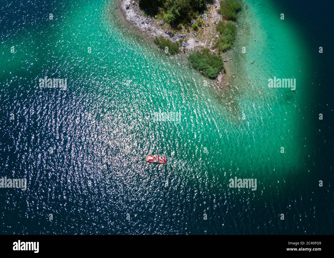 23 June 2020, Bavaria, Grainau: Excursionists take a pedal boat over ...