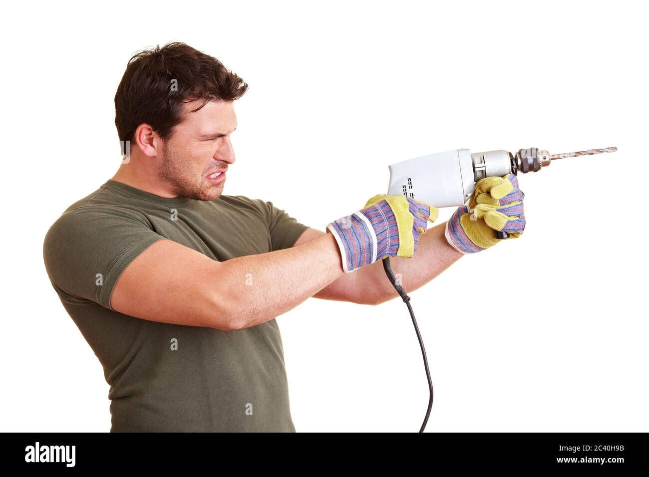 Construction worker with drill drills with a strained face Stock Photo ...