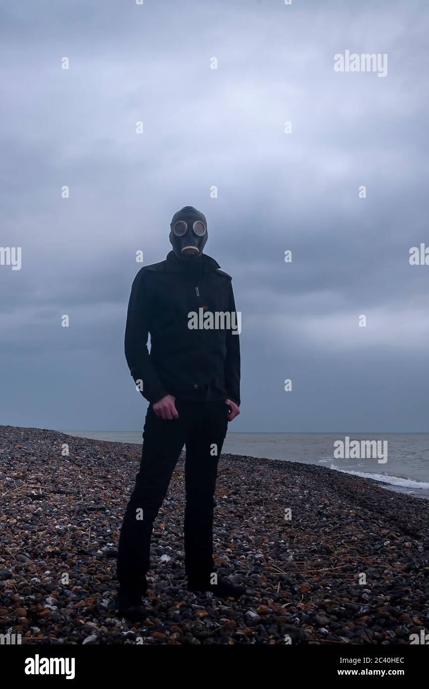 man in gas mask on the beach Stock Photo - Alamy
