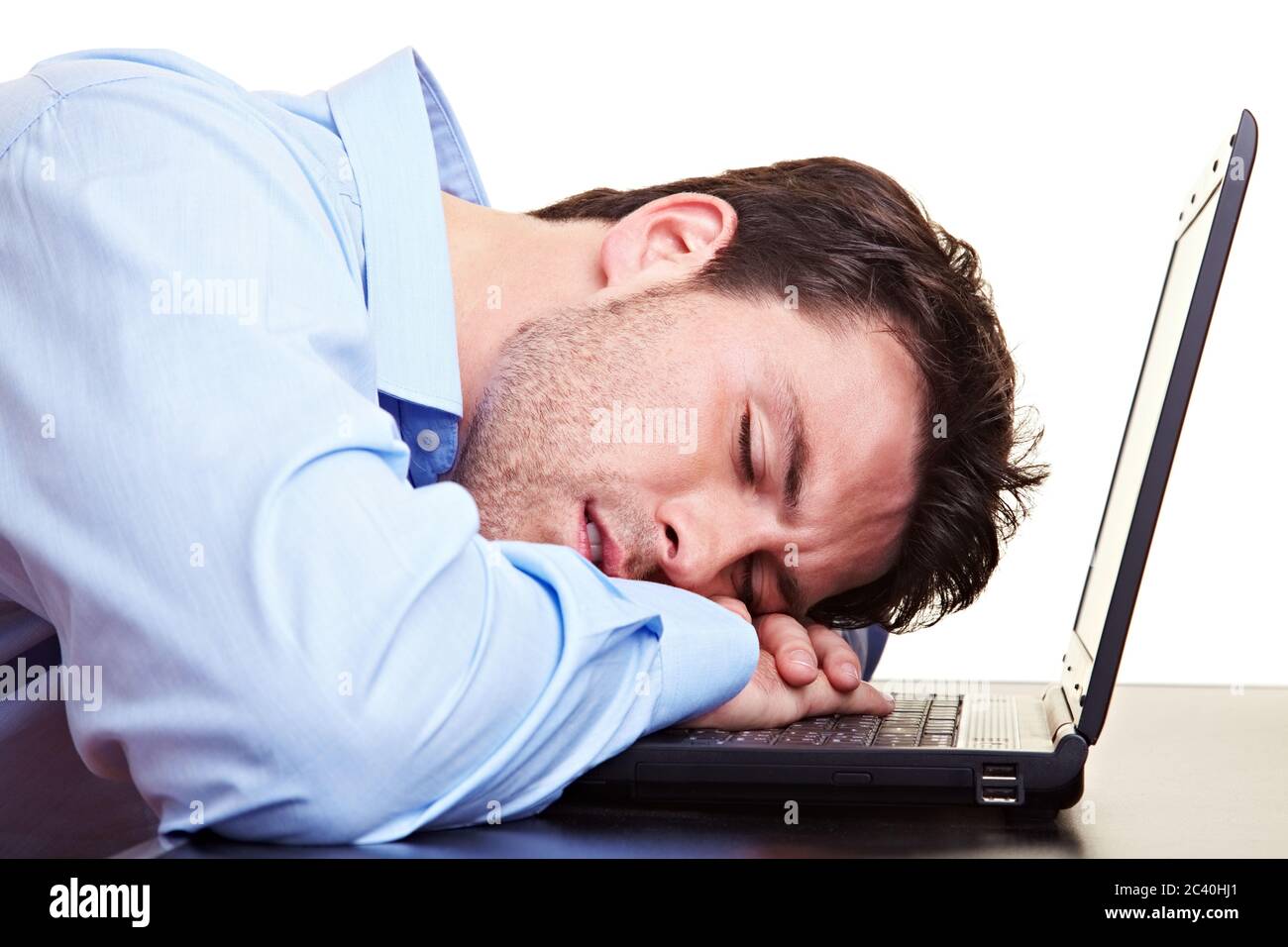 Tired student falls asleep on the keyboard of his laptop Stock Photo ...
