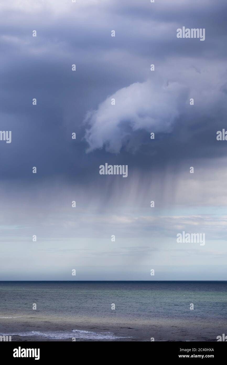 rain clouds hanging over the sea Stock Photo - Alamy